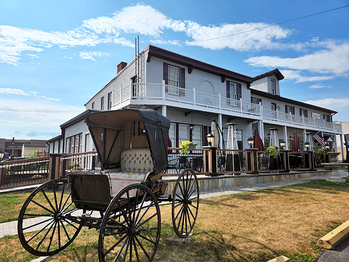 Colonial charm meets Maryland hospitality at the Carriage House Inn's pristine exterior, where that American flag isn't just decoration—it's a promise of classic American cuisine inside.