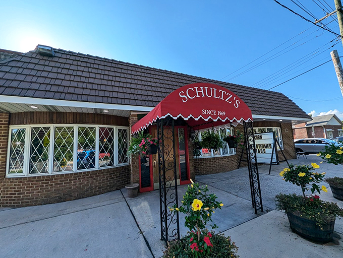 The corner brick building with its sloped roof and American flag stands like a sentry guarding Maryland's seafood heritage. Schultz's doesn't need flash&mdash;just decades of seafood expertise.