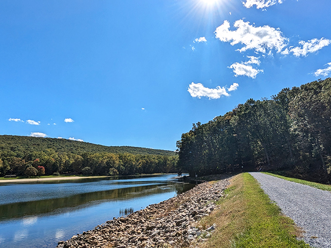 The path less traveled rewards you with this view &ndash; Greenbrier's shimmering lake reflecting the sky like nature's own infinity pool.