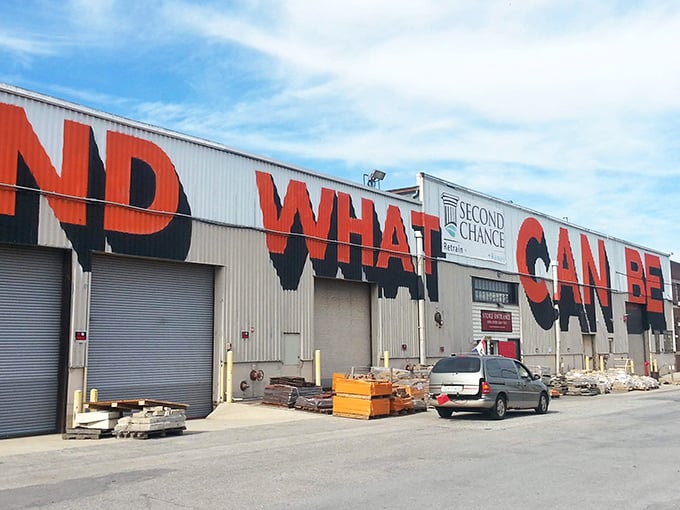 The giant "WHAT" emblazoned across this industrial facade isn't a question—it's the beginning of the treasure hunt that awaits inside Second Chance's massive warehouse.