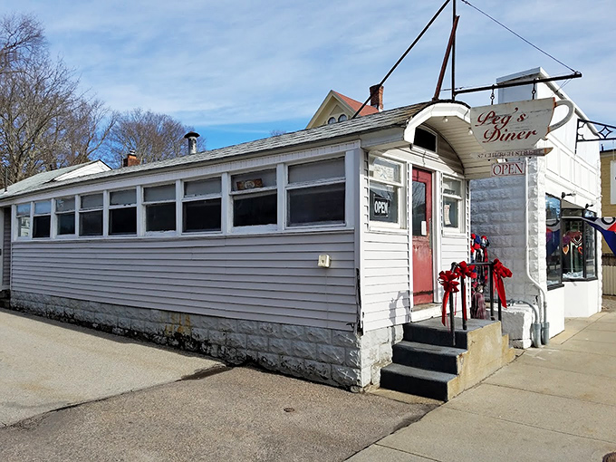 The unassuming white exterior with that pop of red door is like finding a treasure map in your attic&mdash;modest packaging, extraordinary reward inside.