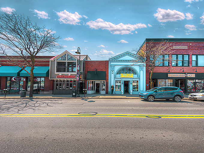 Downtown Charlevoix beckons with its charming storefronts and blue awnings, where Simonsen's Bakery promises sweet treasures worth every calorie.