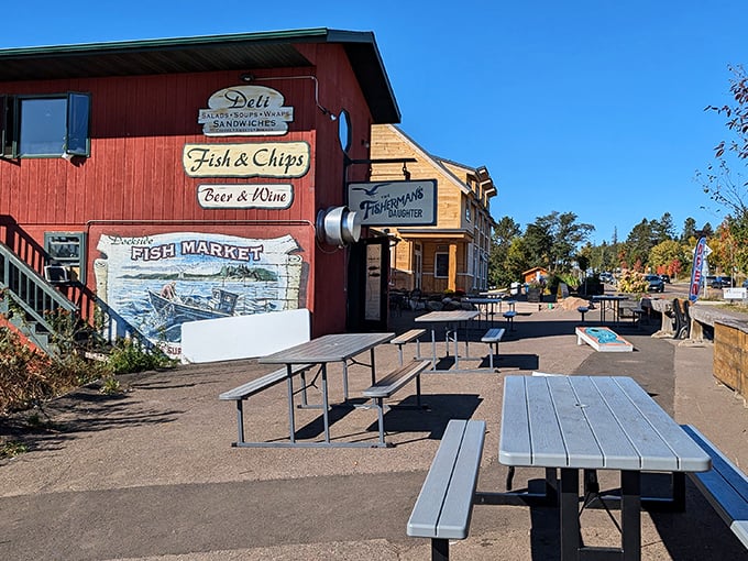 The little red fish shack that could! The Fisherman's Daughter stands proudly on Grand Marais' harbor, promising seafood treasures within its humble walls.