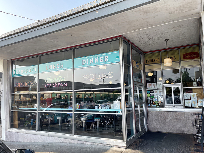 The iconic Brent's Drugs sign glows like a beacon of nostalgia, promising comfort food and conversations that matter in Jackson's Fondren District. 