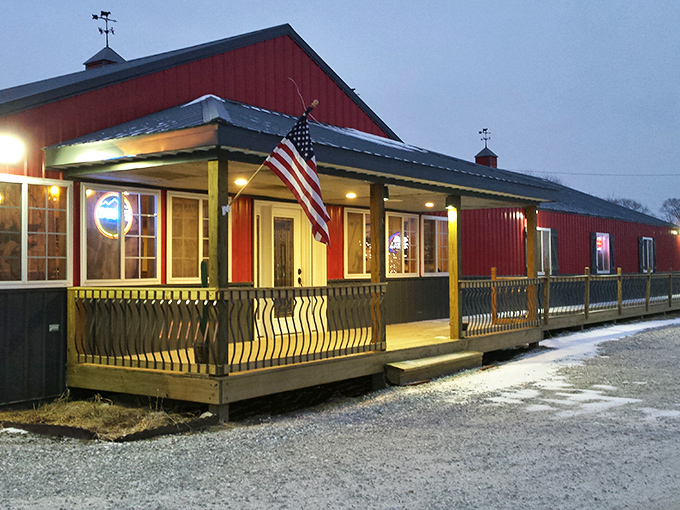 The iconic red exterior of The Hoof glows like a beacon at dusk, promising carnivorous delights within its barn-inspired walls.