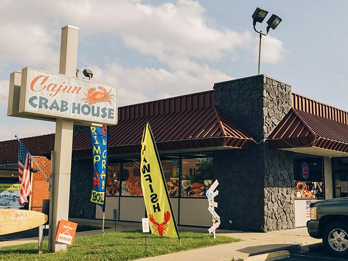 The colorful flags outside Cajun Crab House dance in the Missouri breeze like maritime semaphores signaling seafood salvation in the most landlocked of places.
