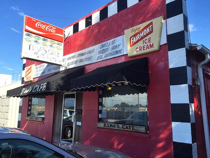 The red and white checkered facade of Tina's Cafe stands like a culinary lighthouse, beckoning hungry travelers with promises of homemade comfort.
