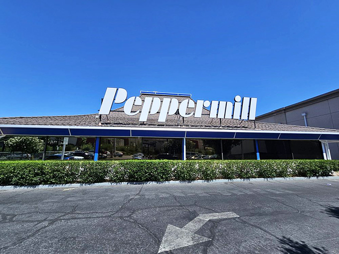 The iconic pagoda-style roof of Peppermill stands like a neon oasis amid the desert of Vegas excess, promising comfort food salvation 24/7.