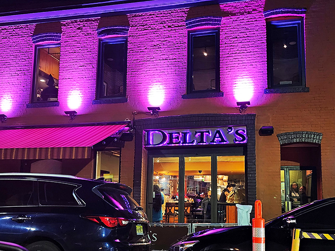 Delta's distinctive brick facade glows with promise at dusk, like a Southern lighthouse beckoning hungry travelers to safe harbor.