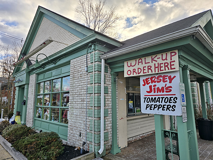 The mint-green exterior of Shut Up and Eat beckons hungry travelers with colorful outdoor seating and a sign that gets straight to the point.
