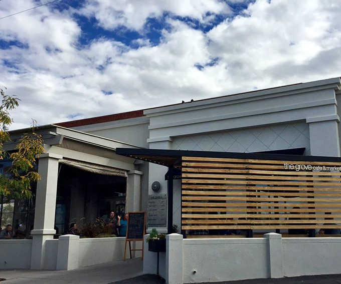 The Grove's unassuming exterior hides culinary treasures within, like finding a Michelin star restaurant disguised as your favorite aunt's house.