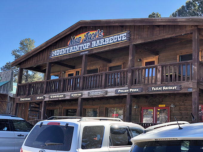 The wooden facade of Mad Jack's stands like a barbecue beacon in the mountains, promising smoky treasures within those rustic walls.