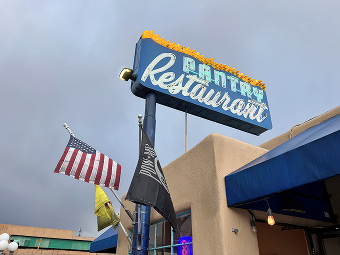 That iconic blue awning against adobe walls isn't just a sign—it's a beacon of breakfast hope for hungry Santa Feans who know the early bird gets the huevos.