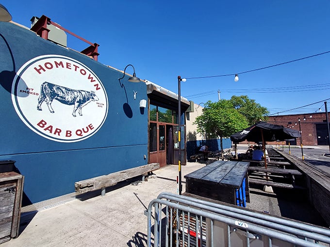 The blue exterior of Hometown Bar-B-Que stands like a beacon for meat pilgrims, promising smoky salvation inside this unassuming Brooklyn treasure.