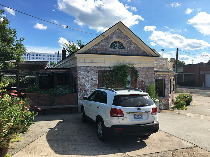 The unassuming brick exterior of Geer Street Garden, a former gas station transformed into Durham's deviled egg headquarters, welcomes visitors with blue flower pots and casual charm. 