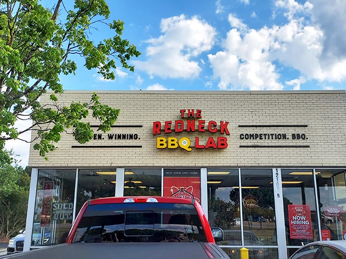 The modest storefront belies the flavor explosion waiting inside &ndash; where "Competition. BBQ." isn't just a tagline, it's a scientific promise.