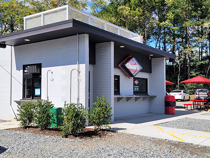 The unassuming white brick exterior of Cheat's Cheesesteaks proves once again that culinary treasures often hide in the simplest packages.