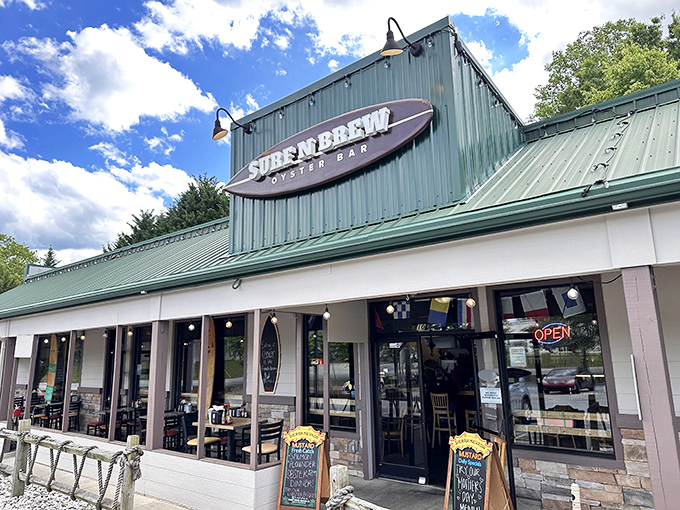 The surfboard sign announces your arrival at seafood paradise &ndash; where mountain air meets maritime flavor in Fletcher's unexpected coastal outpost. 