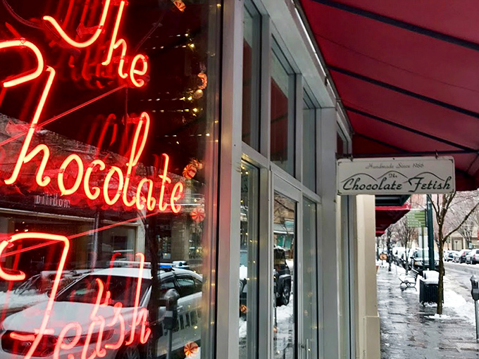 The storefront beckons like a chocolate siren, with award certificates proudly displayed. Resistance is futile&mdash;just look at that "OPEN" sign glowing with promise.