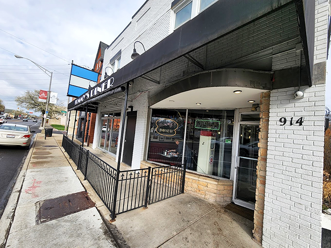 That iconic red and white sign isn't just advertising &ndash; it's a time machine promising comfort food and nostalgia at Tommy's Diner in Columbus.