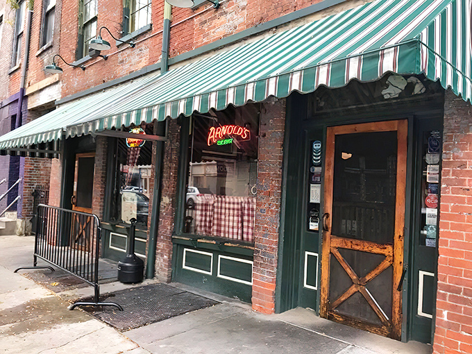 The unassuming exterior of Arnold's Bar & Grill beckons with its vintage charm and green-striped awning&mdash;Cincinnati's worst-kept secret hiding in plain sight.