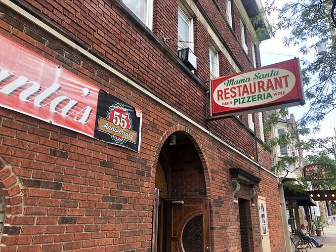 The unassuming brick corner that houses pizza paradise. Like Clark Kent's glasses, this modest exterior hides superhero-level Italian food inside.