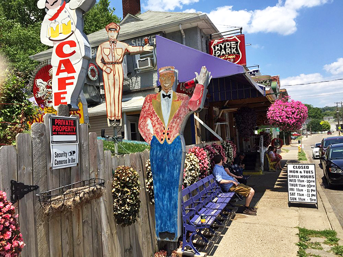 Welcome to wonderland! The Turf Club's exterior is a carnival of life-sized figures, vibrant flowers, and the kind of delightful chaos that promises unforgettable meals ahead.