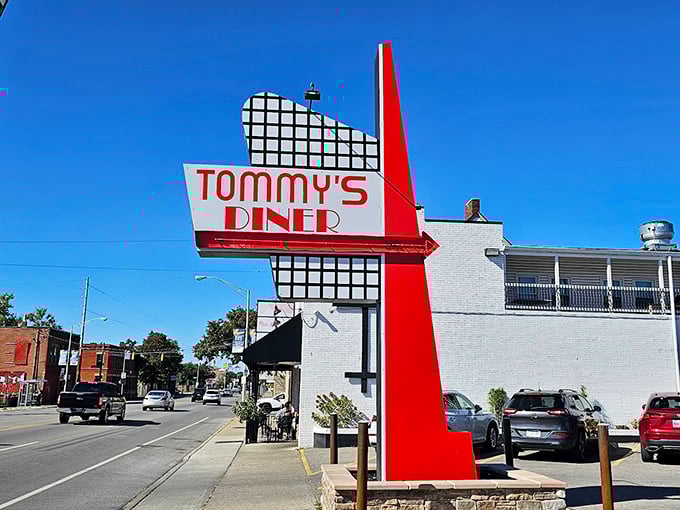 Tommy's Diner stands like a time capsule on West Broad Street, its classic black awning and white brick promising honest-to-goodness comfort inside.