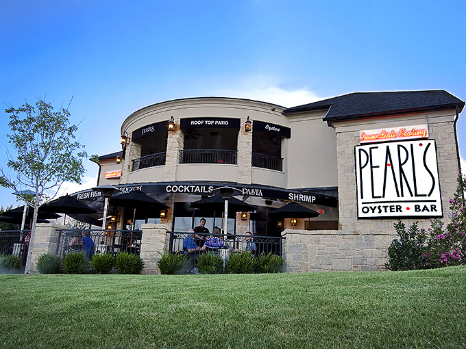 Pearl's striking stone exterior stands like a coastal mirage in Oklahoma City, complete with a rooftop patio that begs for sunset cocktails and seafood feasts.