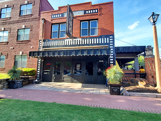 The brick-lined entrance to Deep Deuce Grill beckons like an old friend, promising good times and even better food in this historic Oklahoma City district.