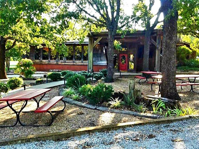 A garden path that promises culinary treasures ahead. Fireside Dining's entrance combines rustic charm with Oklahoma hospitality, inviting you to slow down and savor what's coming.