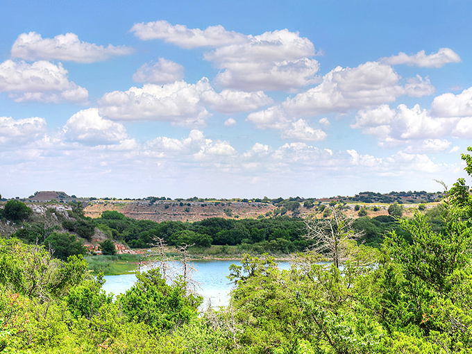 Mother Nature's masterpiece unfolds at Lake Watonga, where Oklahoma's blue skies reflect perfectly in waters that have quenched thirsts for centuries.