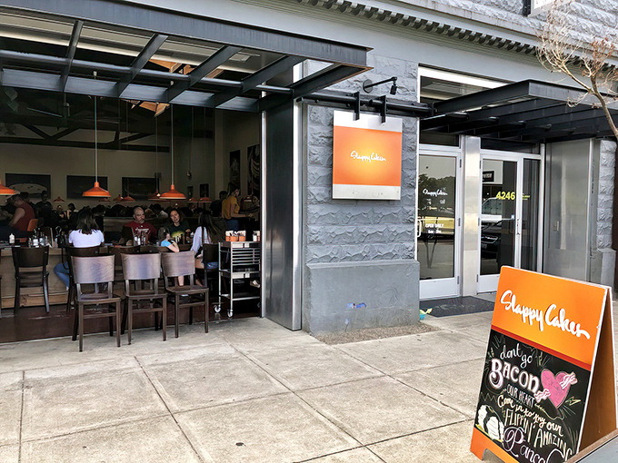 The unmistakable orange glow of Slappy Cakes stands out against Portland's gray skies like a breakfast beacon calling you home.