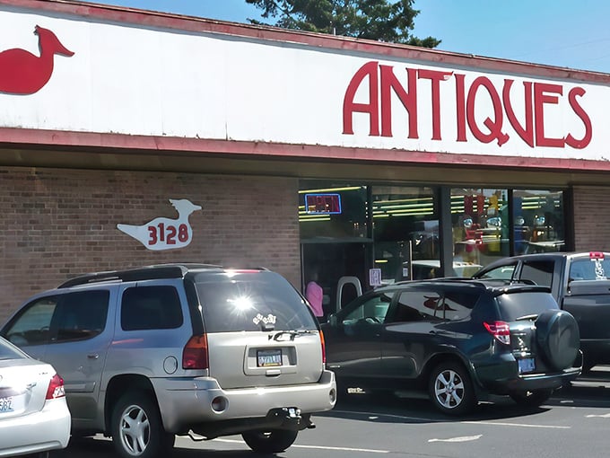 The unassuming exterior of Little Antique Mall belies the wonderland within. That bold red "ANTIQUES" sign is like a beacon to treasure hunters on Highway 101.