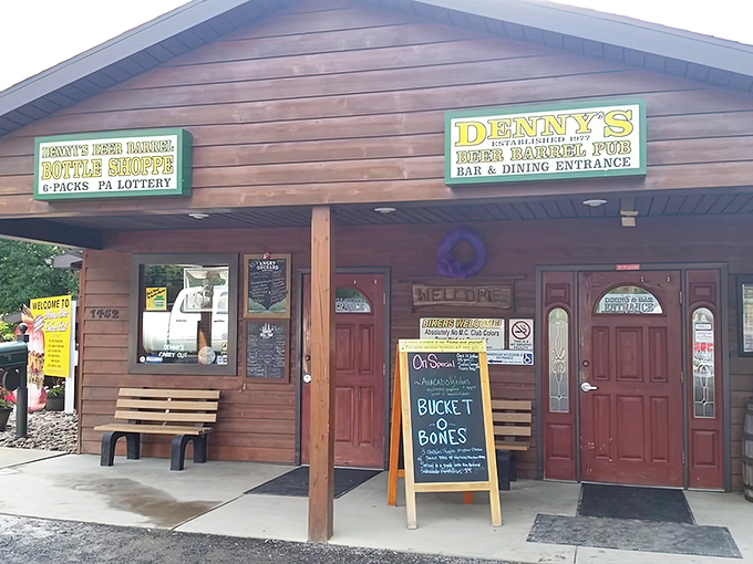 The unassuming wooden exterior of Denny's Beer Barrel Pub &ndash; where burger legends are born and diets go to die.
