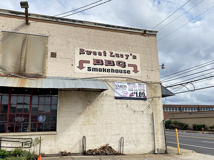 The bright blue exterior of Sweet Lucy's stands out like a barbecue beacon in Northeast Philly, promising smoky treasures within those barn-like walls.