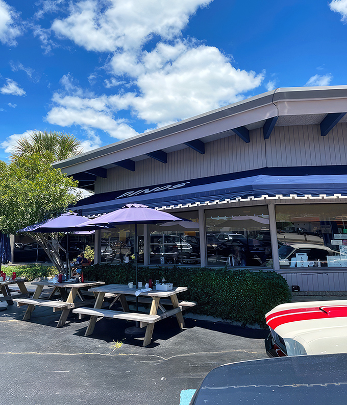 The unassuming blue awning of Dino's beckons like a breakfast lighthouse, guiding hungry souls through the morning fog of indecision.