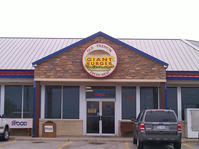The stone facade and iconic circular sign promise what lies within: burger nirvana waiting just off the highway.