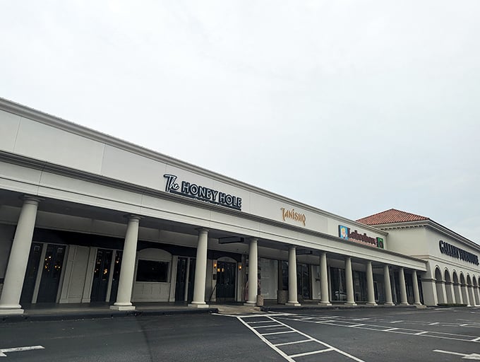 The unassuming storefront belies the culinary treasures within. Like finding a secret speakeasy, but instead of bootleg whiskey, you get life-changing shrimp and grits.
