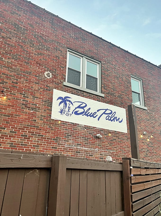 From the outside, The Blue Palm plays it cool &ndash; a modest brick building that keeps its tropical treasures hidden like a speakeasy with sunscreen.