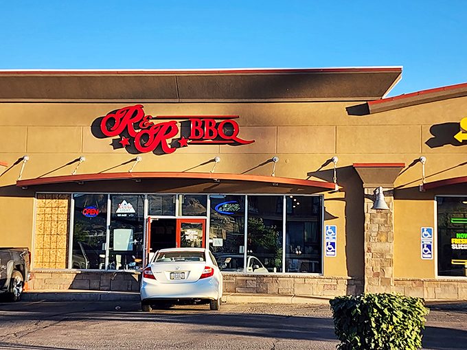 The red R&R BBQ sign beckons like a smoky siren call against the Utah sky. Simplicity on the outside belies the flavor explosion waiting within.