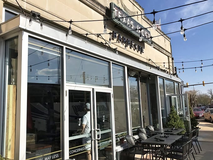 The inviting exterior of Texas Jack's Barbecue beckons with its vintage-style neon sign and string lights&mdash;like a beacon of smoky salvation on Arlington's Washington Boulevard.