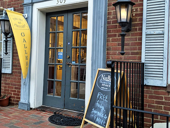 The unassuming brick storefront of NazBro Chocolates beckons with a promise that's impossible to resist: FREE FUDGE SAMPLES. Resistance is futile.