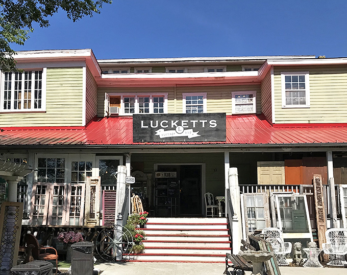 The unassuming facade of Old Lucketts Store beckons like a vintage postcard come to life, complete with that signature red roof and welcoming porch steps.