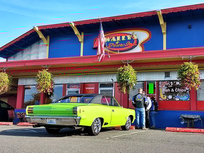 The vibrant red, blue, and yellow exterior of Wally's isn't just eye-catching—it's a time portal to when drive-ins ruled the American landscape.