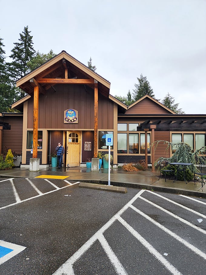 The Oak Table Cafe stands like a woodland retreat among Silverdale's evergreens, promising pancake paradise behind those timber beams.