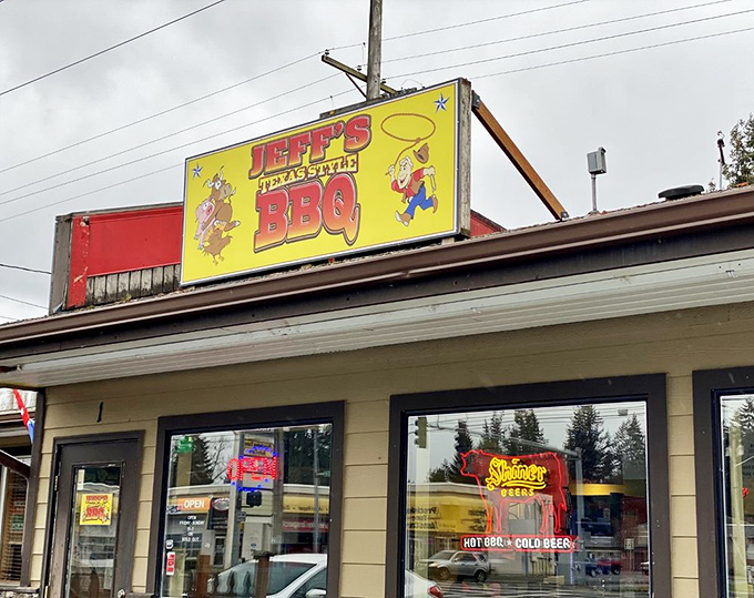 The bright yellow sign of Jeff's Texas Style BBQ beckons hungry travelers like a smoky lighthouse guiding ships through fog.
