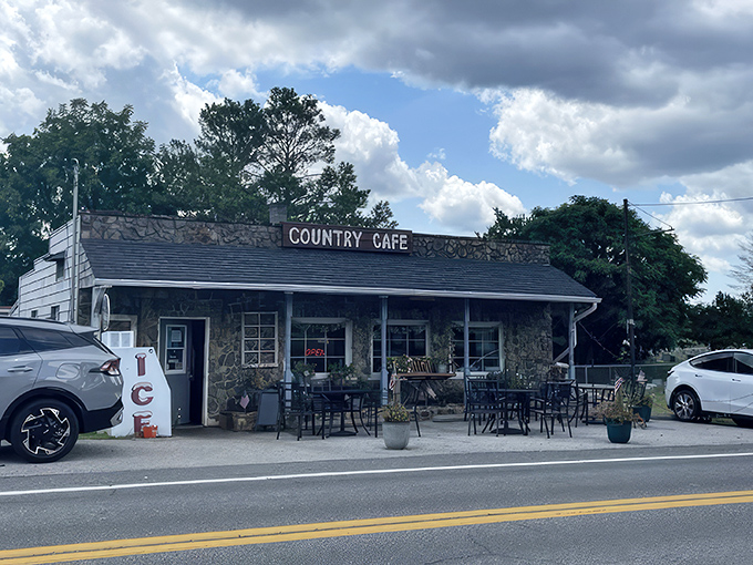 The stone facade of Country Café stands like a culinary time capsule in Harpers Ferry, promising comfort food treasures within its unassuming walls.