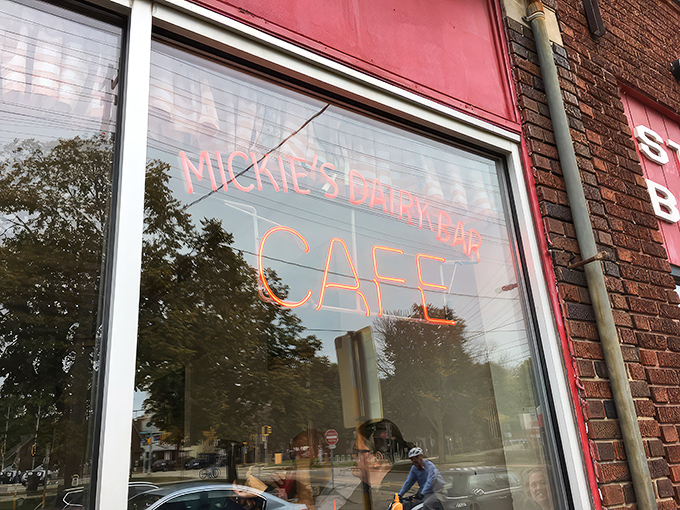 The iconic Mickies Dairy Bar sign stands proudly against Madison's skyline, a beacon of breakfast hope for hungry Badger fans and locals alike. 