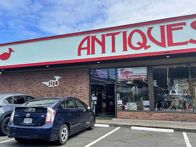 The unassuming exterior of Little Antique Mall belies the wonderland within. That bold red "ANTIQUES" sign is like a beacon to treasure hunters on Highway 101.